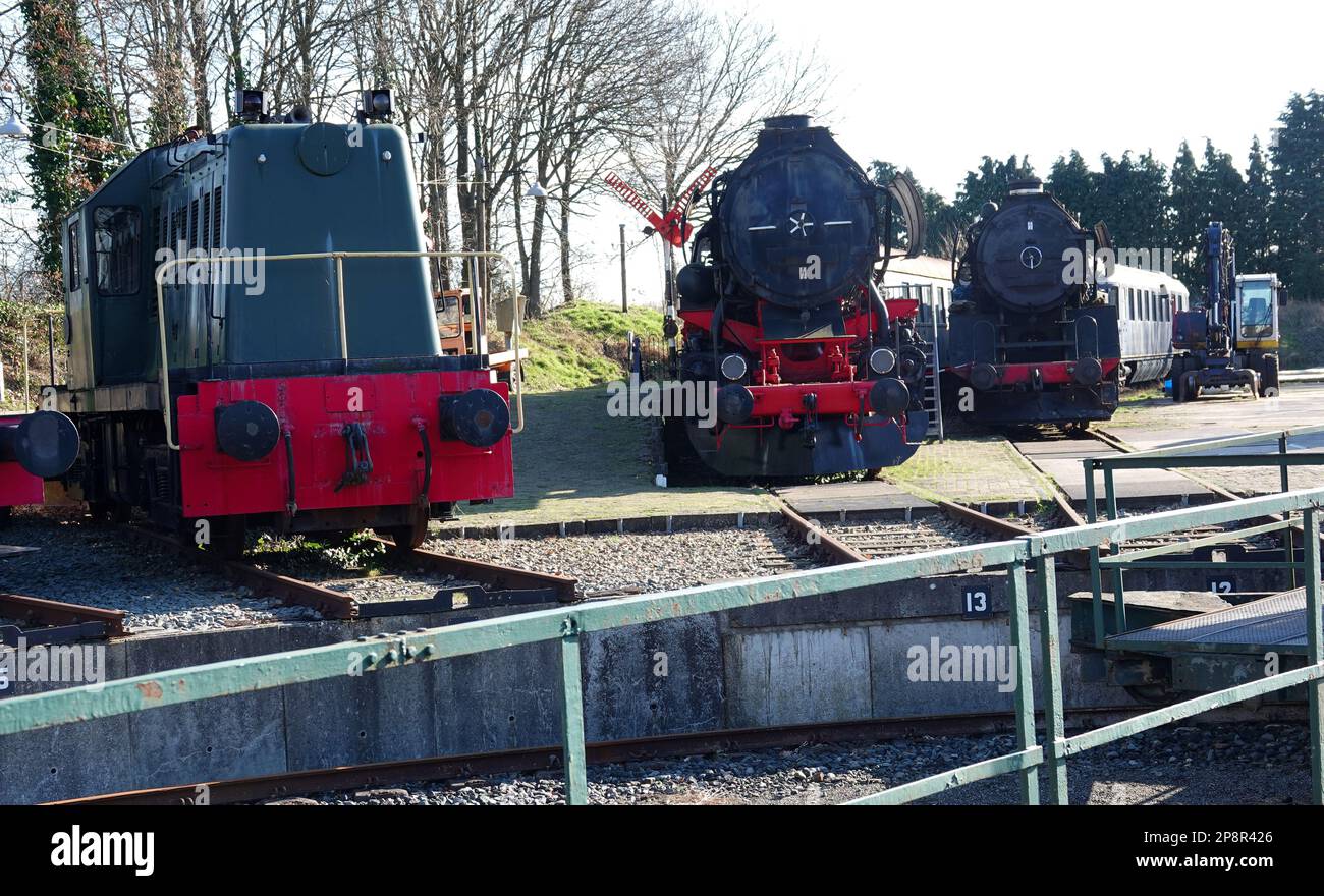 Three old steam locomotives face a railroad turntable at the old ...