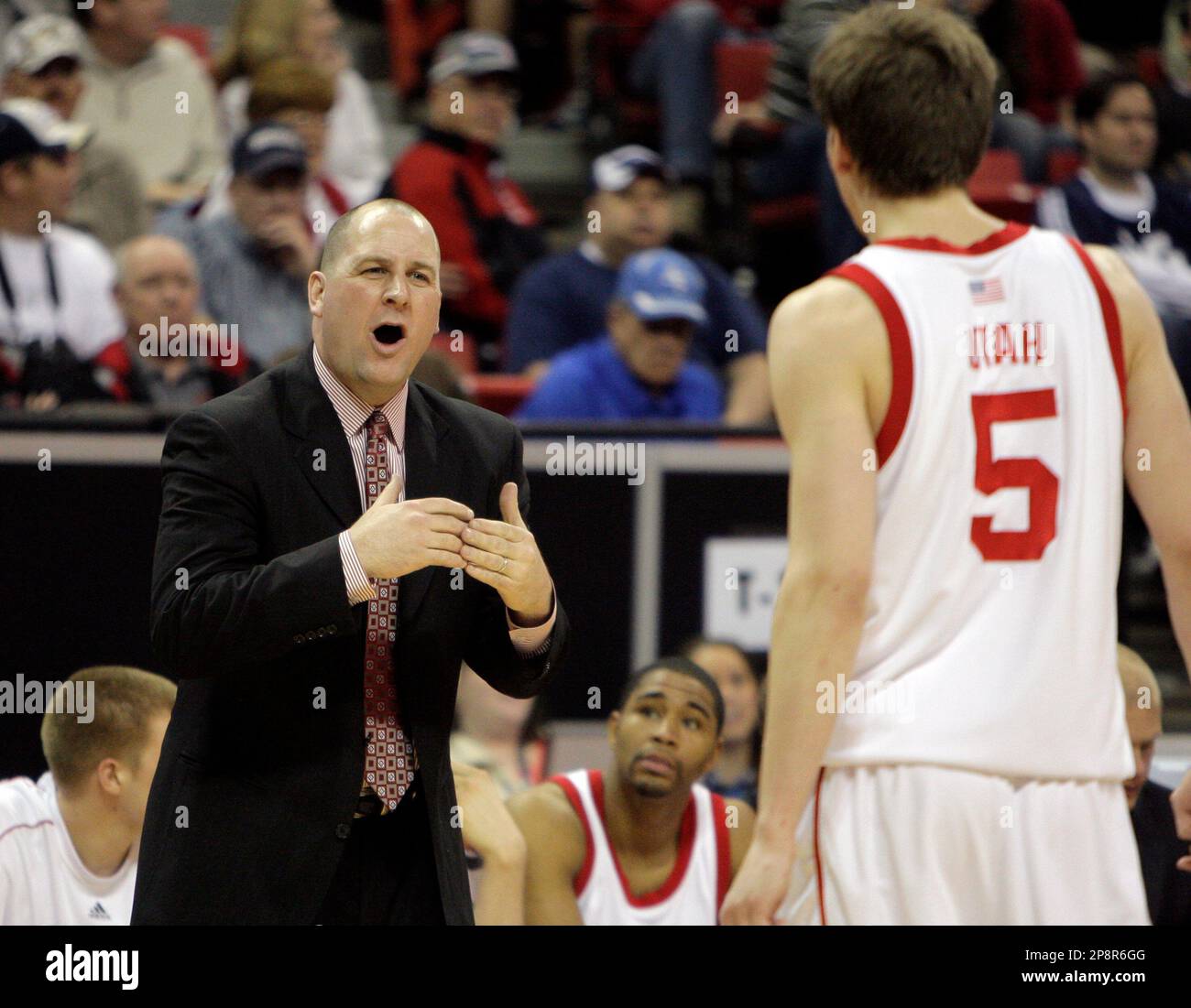 Utah head coach Jim Boylen, left, talks to his player Luka Drca during ...