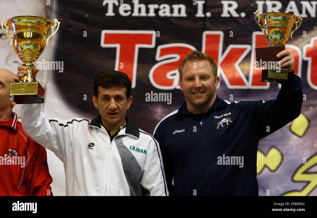 US wrestling team coach Brandon Slay, right, and his Iranian ...