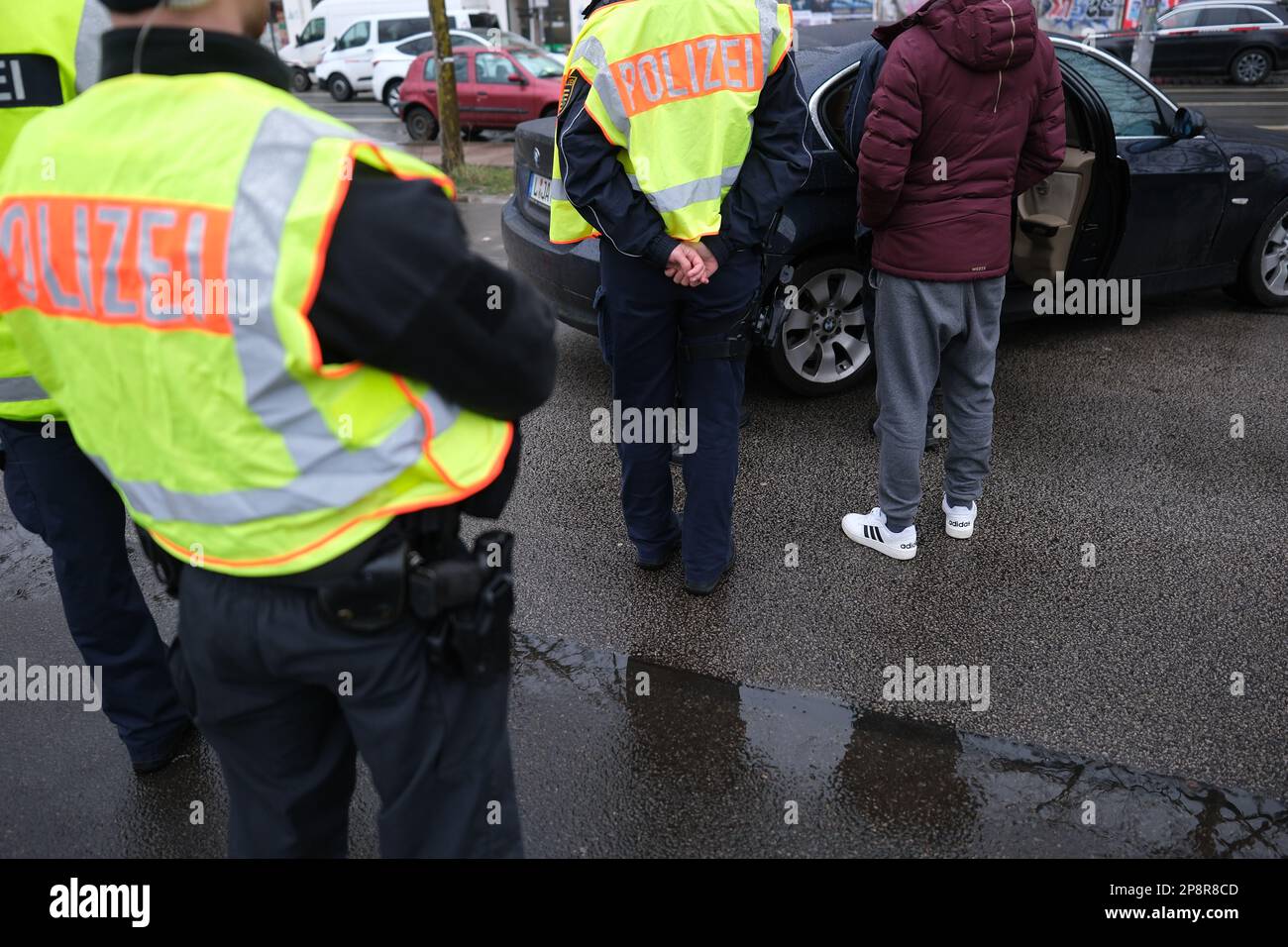 Leipzig, Germany. 09th Mar, 2023. Police officers check a car on ...