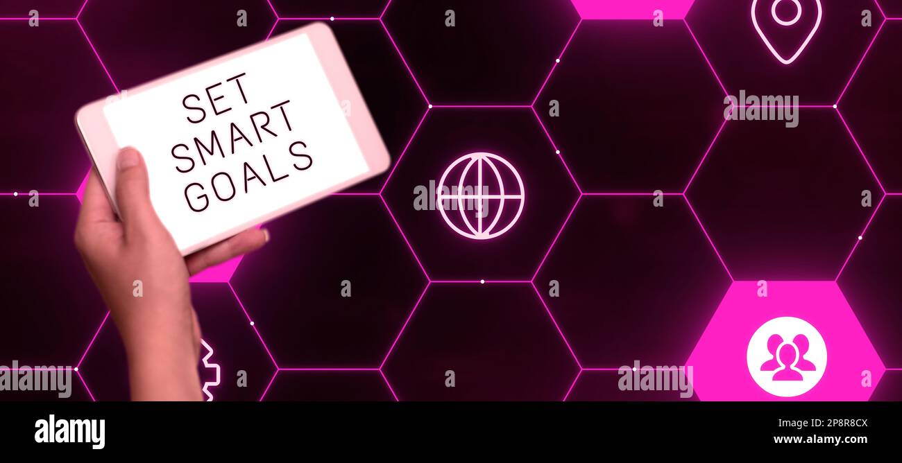 Hand writing sign Set Smart Goals. Word Written on Establish achievable ...