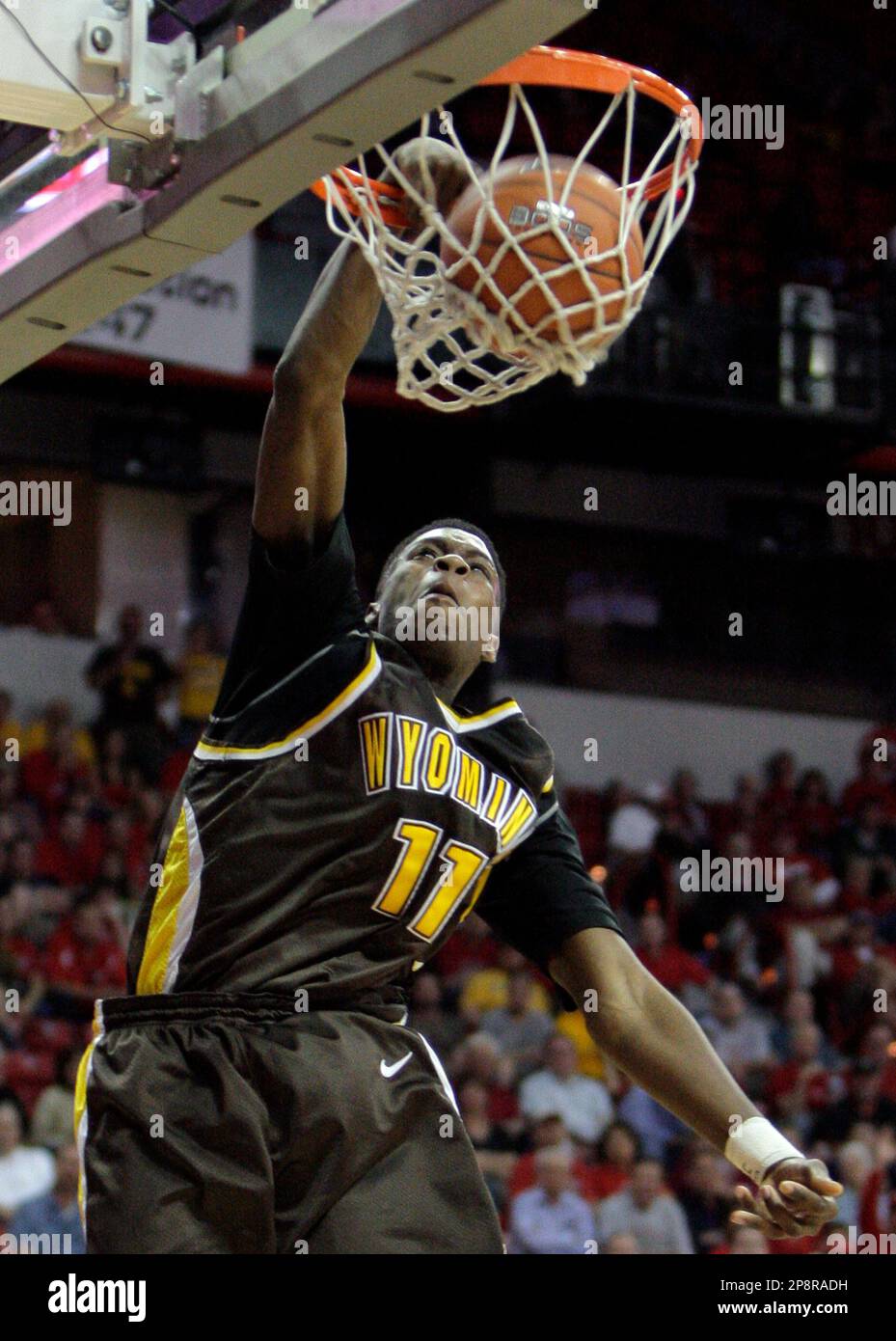 Wyoming's Afam Muojeke dunks against New Mexico during the second half ...