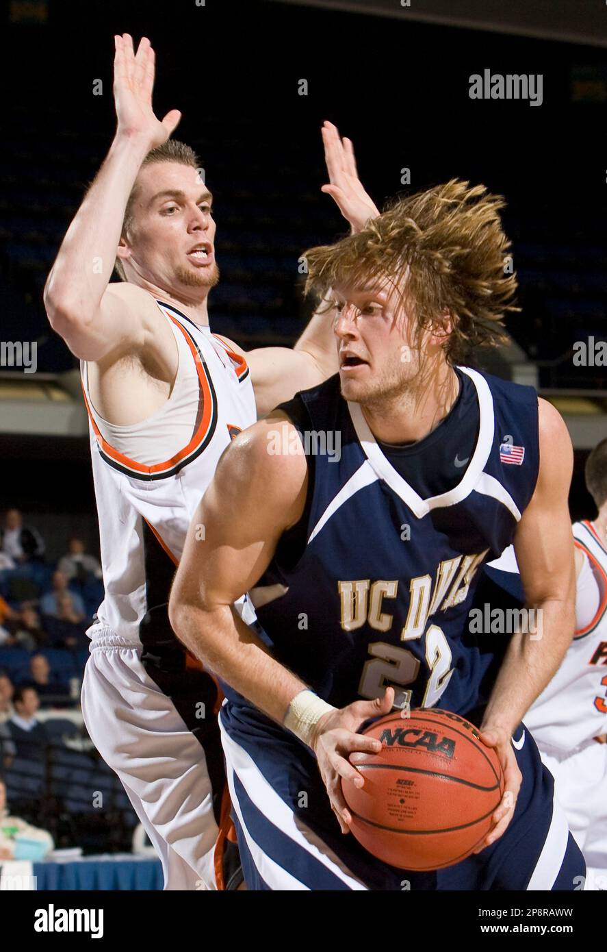 UC Davis guard Joe Harden, right, tries to spin around Pacific forward ...