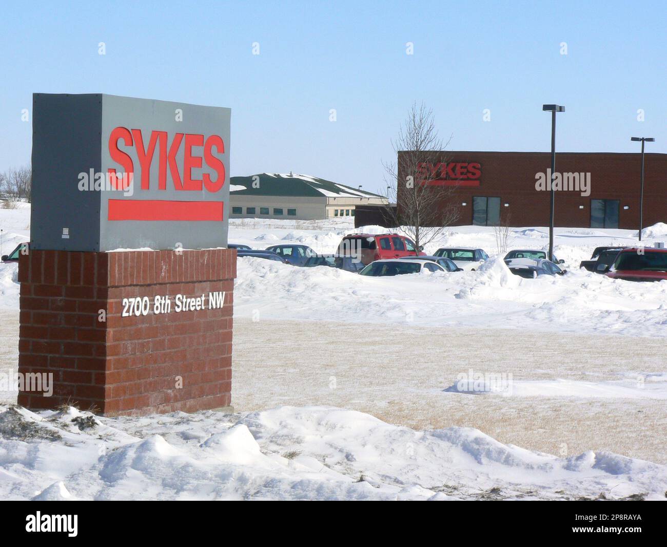 Sykes Enterprises Logo