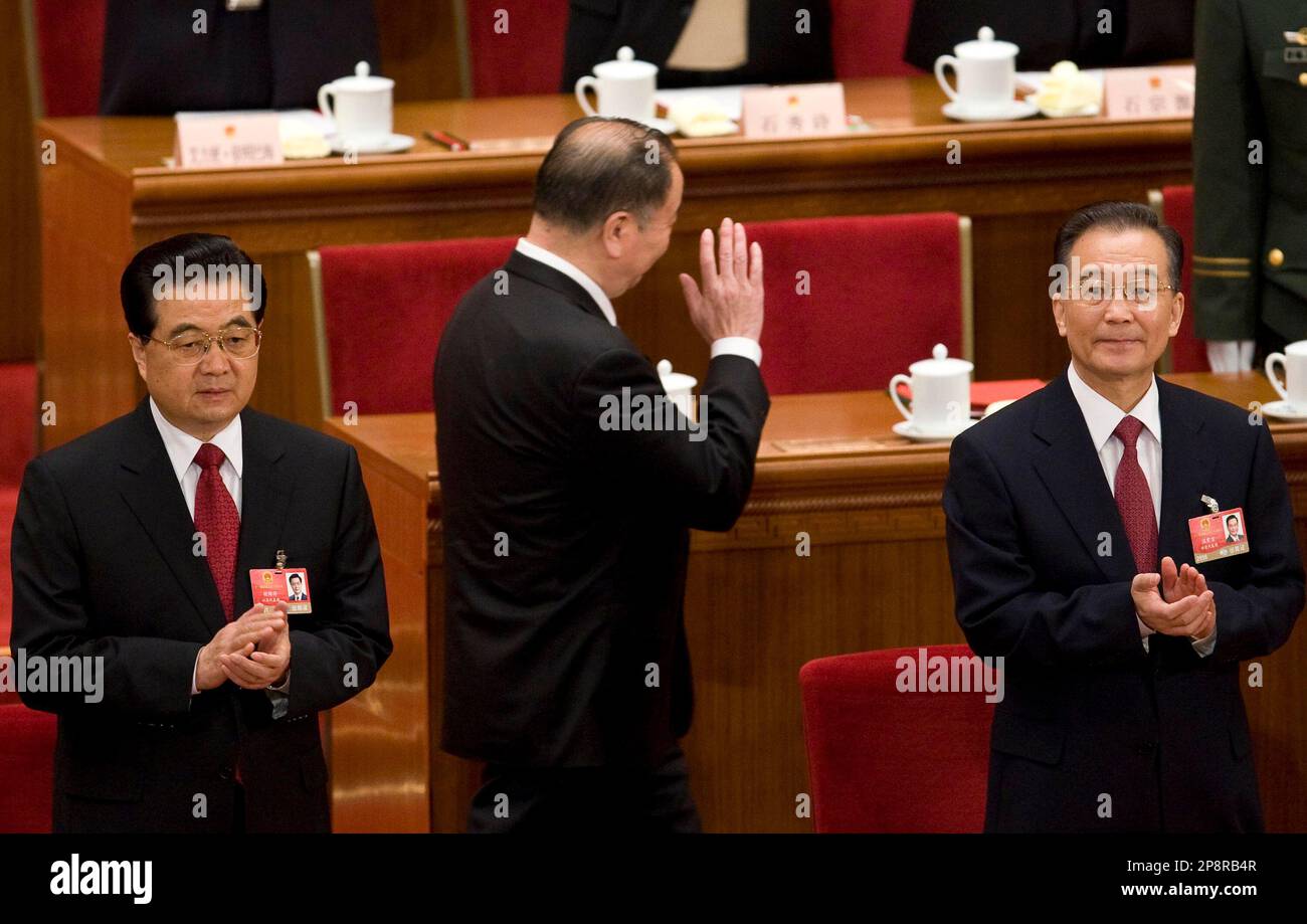 Chinese President Hu Jintao, left, and Premier Wen Jiabao, right, clap after arriving at the ...