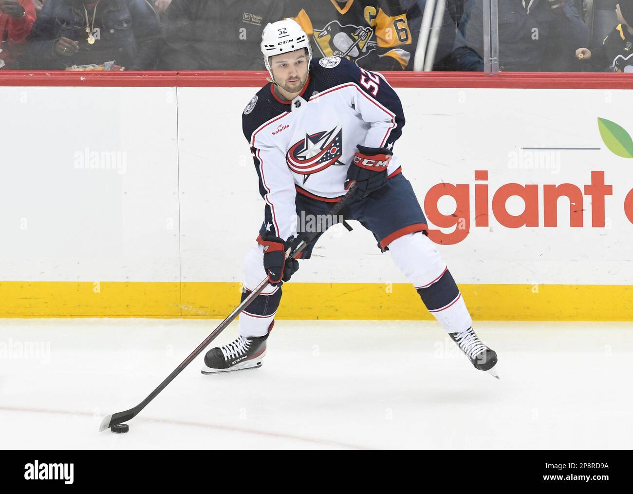 Columbus Blue Jackets right wing Emil Bemstrom (52) moves the puck ...