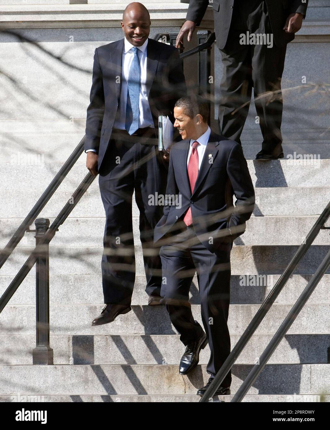 President Barack Obama walks with his aide Reggie Love, as they leave ...