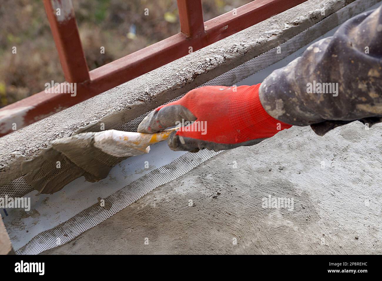spreading the waterproofing tape with a special solution Stock Photo ...