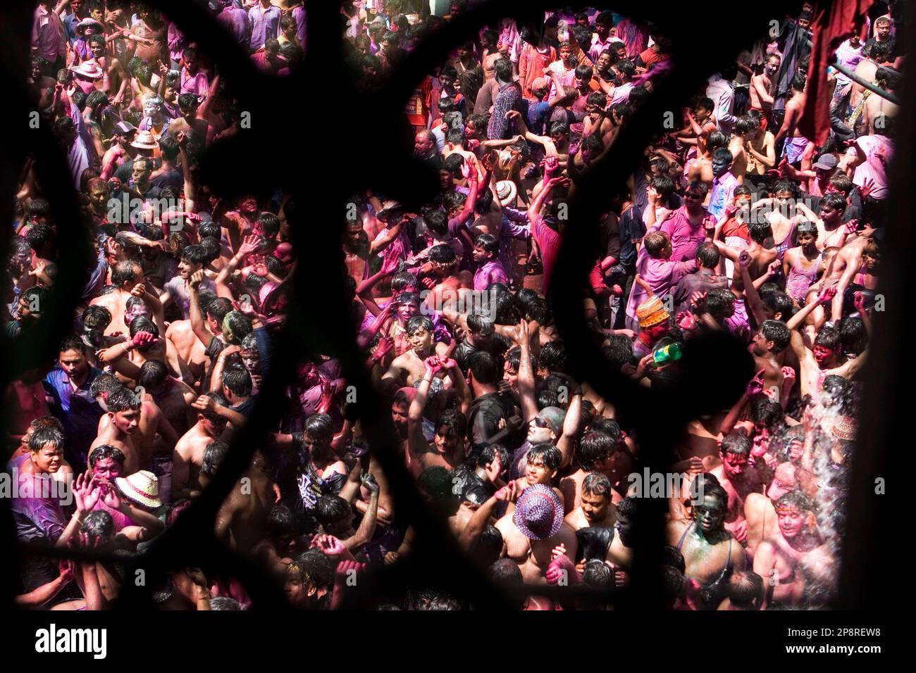 People dance as they celebrate “Holi”, the Indian spring festival of ...