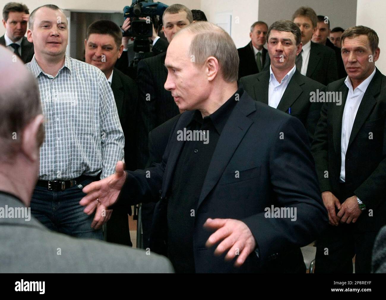 Russian Prime Minister Vladimir Putin, foreground, meets with miners of ...