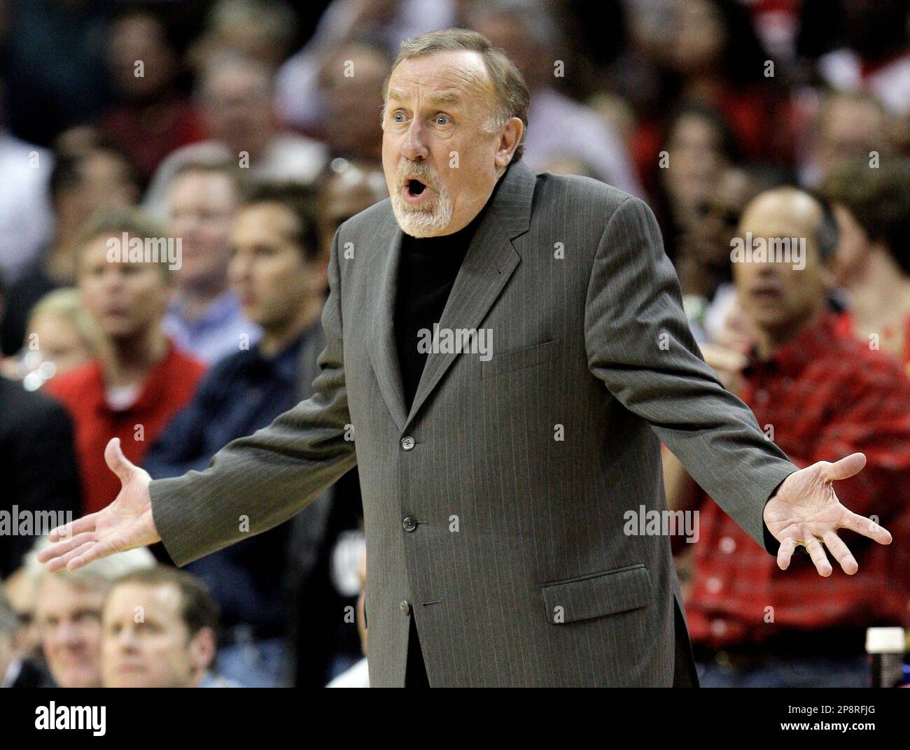 Houston Rockets coach Rick Adelman reacts after his team is called for ...