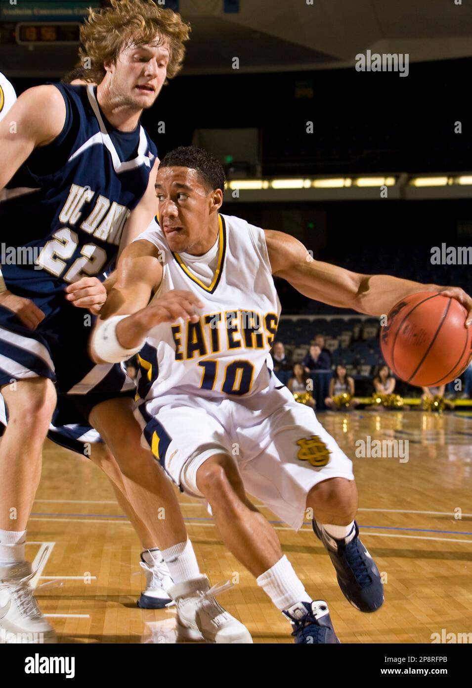 UC Irvine guard Patrick Rembert, right, drives around UC David guard ...