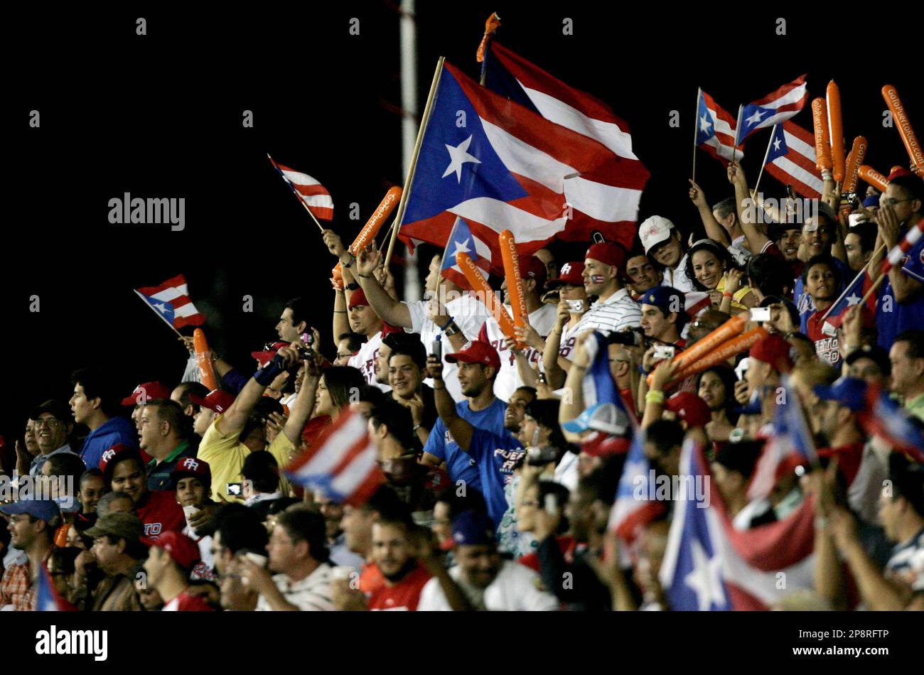 Puerto Rico's fans cheer at the end of a World Baseball Classic game ...