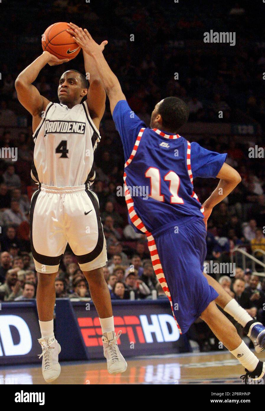 Providence's Sharaud Curry (4) shoots over DePaul's Jeremiah Kelly (11 ...