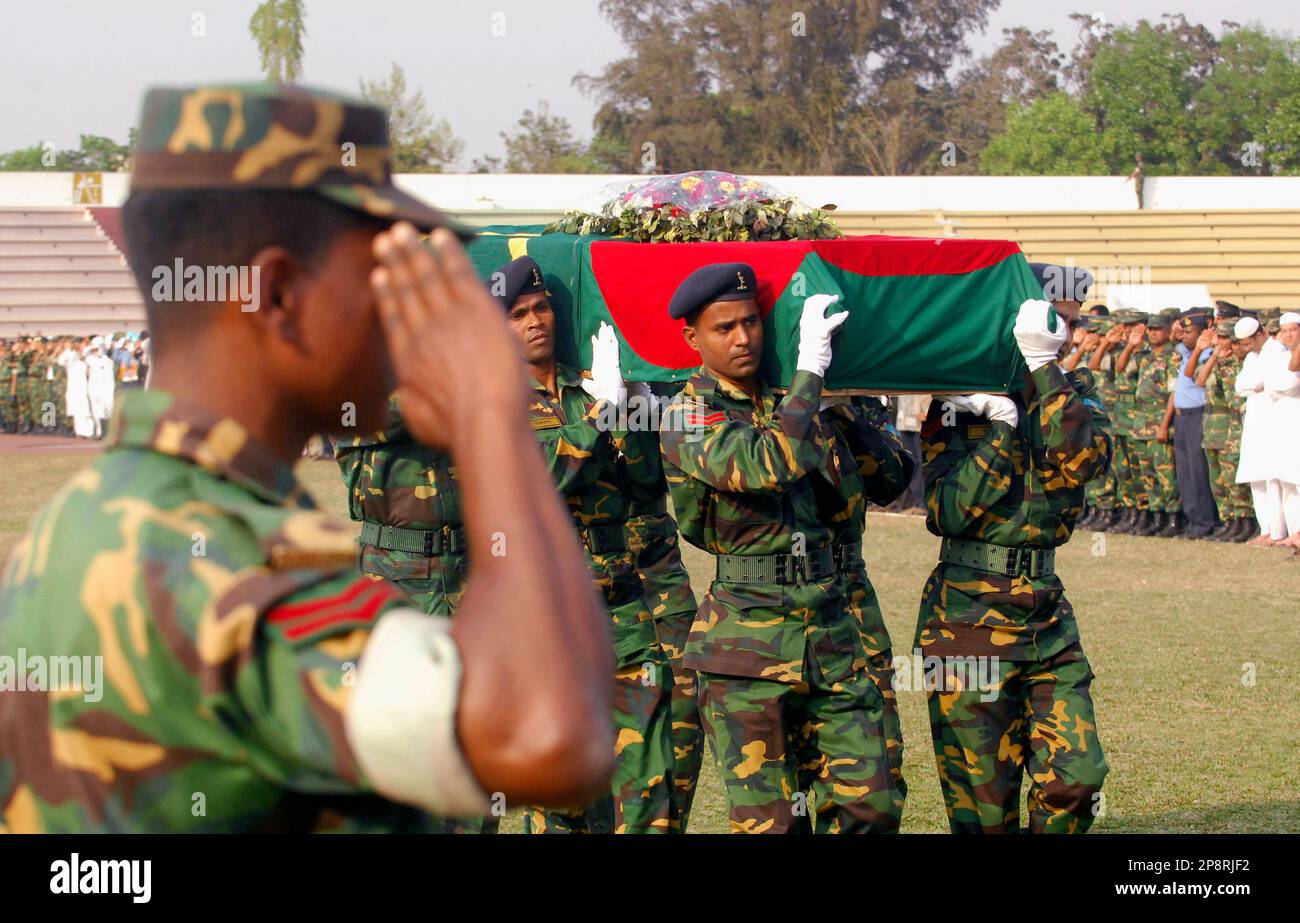 Soldiers carry the coffin of Maj. Gen. Rafiqul Islam, general officer ...