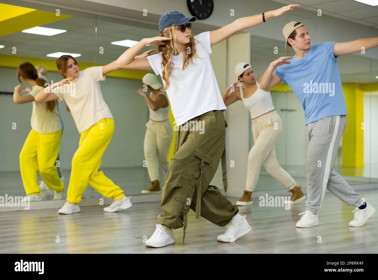 Teen girl in cap dancing modern dances Stock Photo - Alamy