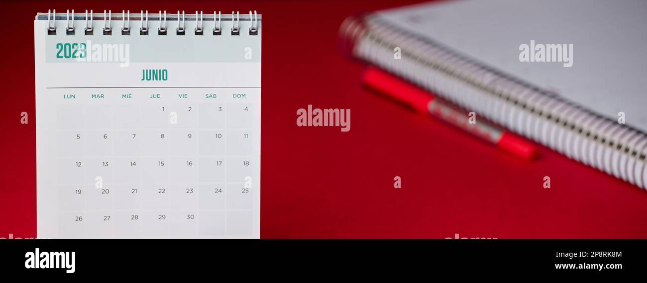 A calendar on a desk with the year 2023 June, red table Stock Photo - Alamy