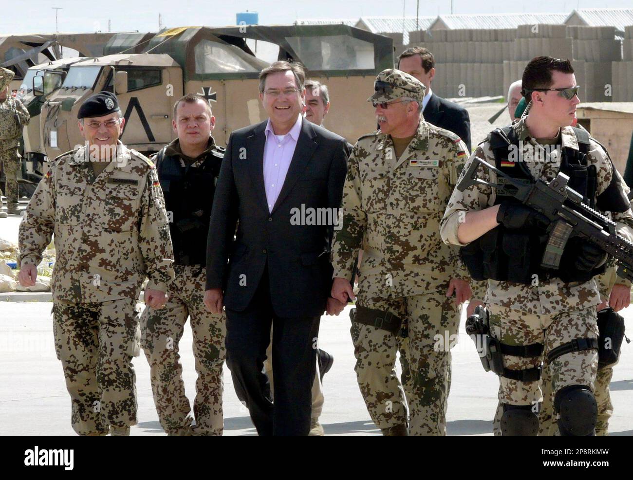 Germany's Defense Minister Franz Josef Jung, third left, walks after ...
