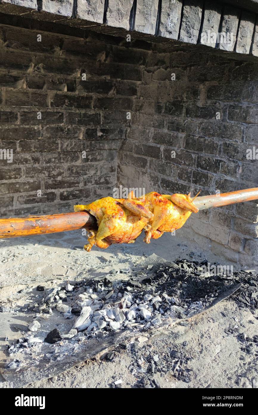 Chicken on spit in grill hi-res stock photography and images - Alamy
