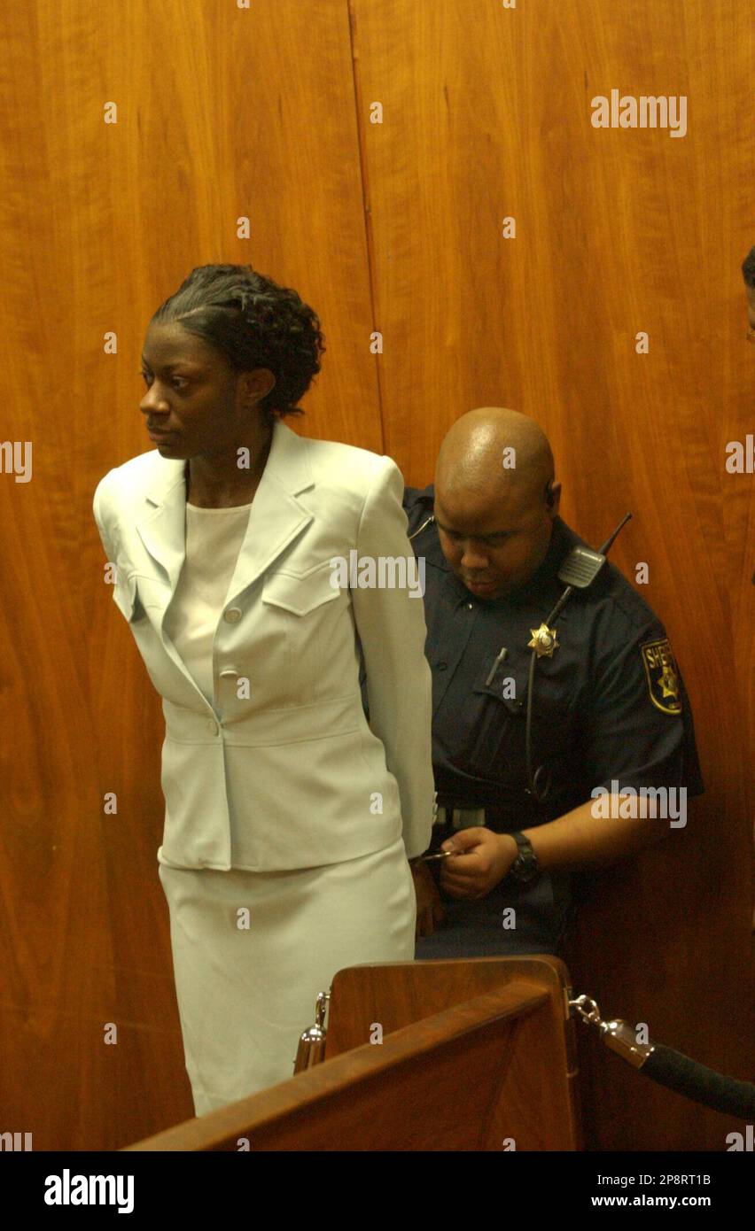 Falicia Blakely (cq) waits as DeKalb Dpt. Reginald Fluker (cq) takes ...