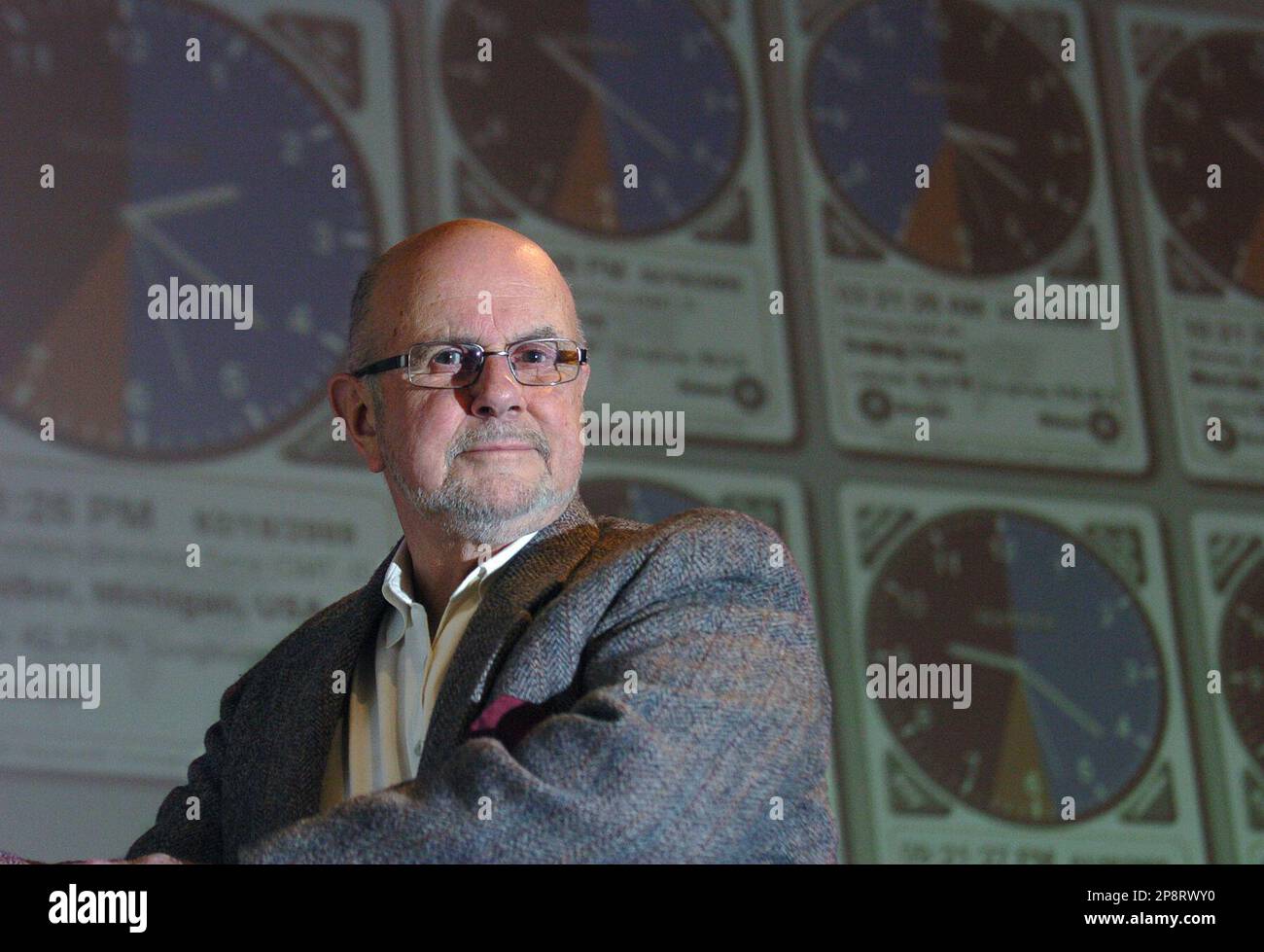 John Rosevear poses in front of a projection of his Skyclock, on the ...