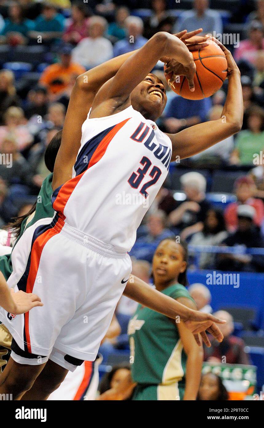 Connecticut's Kalana Greene (32) grabs a rebound from South Florida's ...