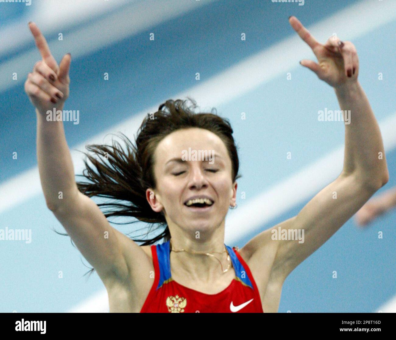 Russia's Mariya Savinova celebrates as she wins the gold medal in the ...