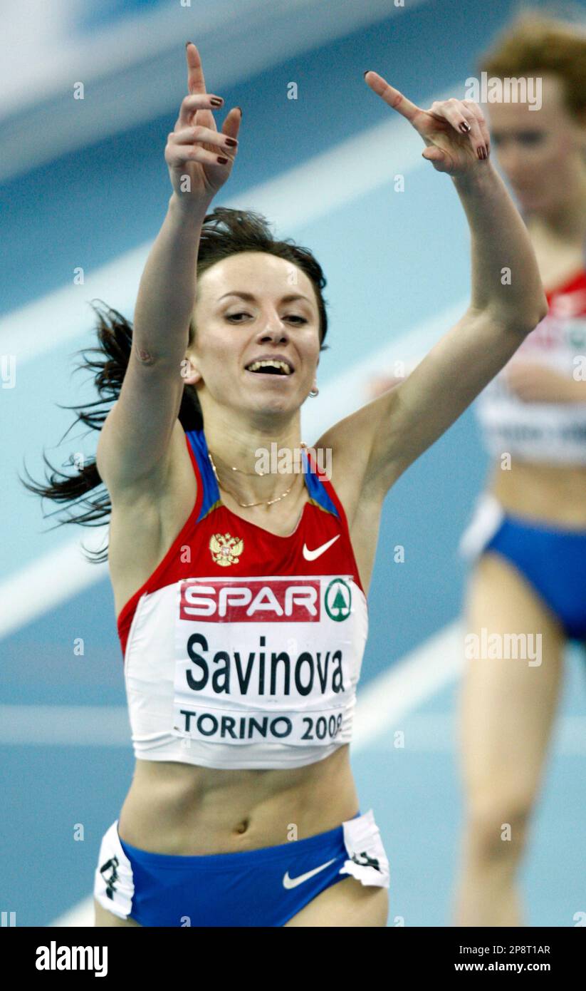 Russia's Mariya Savinova celebrates as she wins the gold medal in the ...