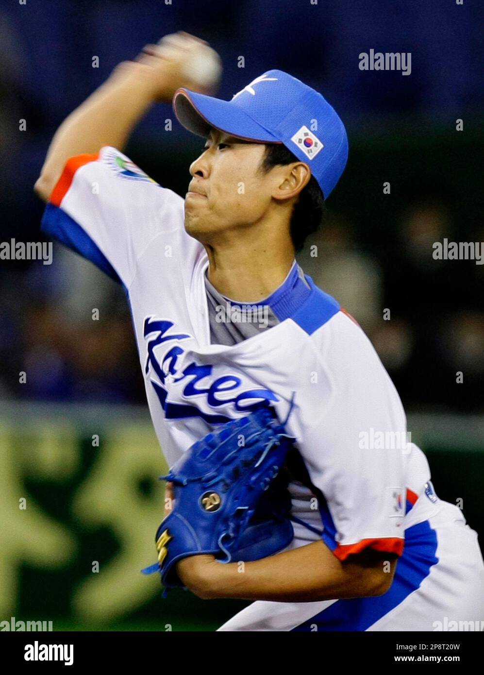 Team South Korea starter Yoon Suk-min pitches against Team China in the ...