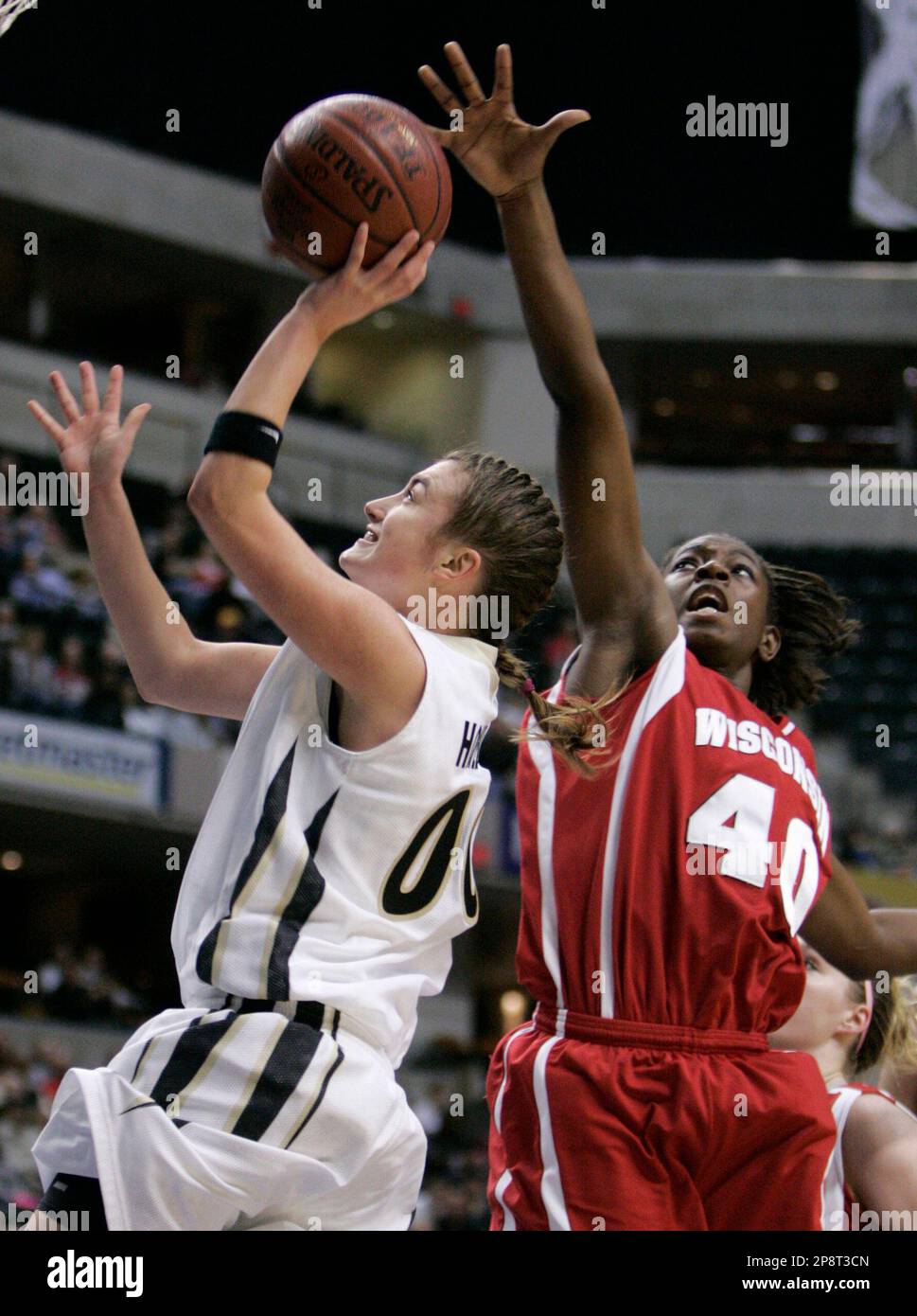 Purdue guard Jodi Howell, left, shoots under Wisconsin forward Anya ...