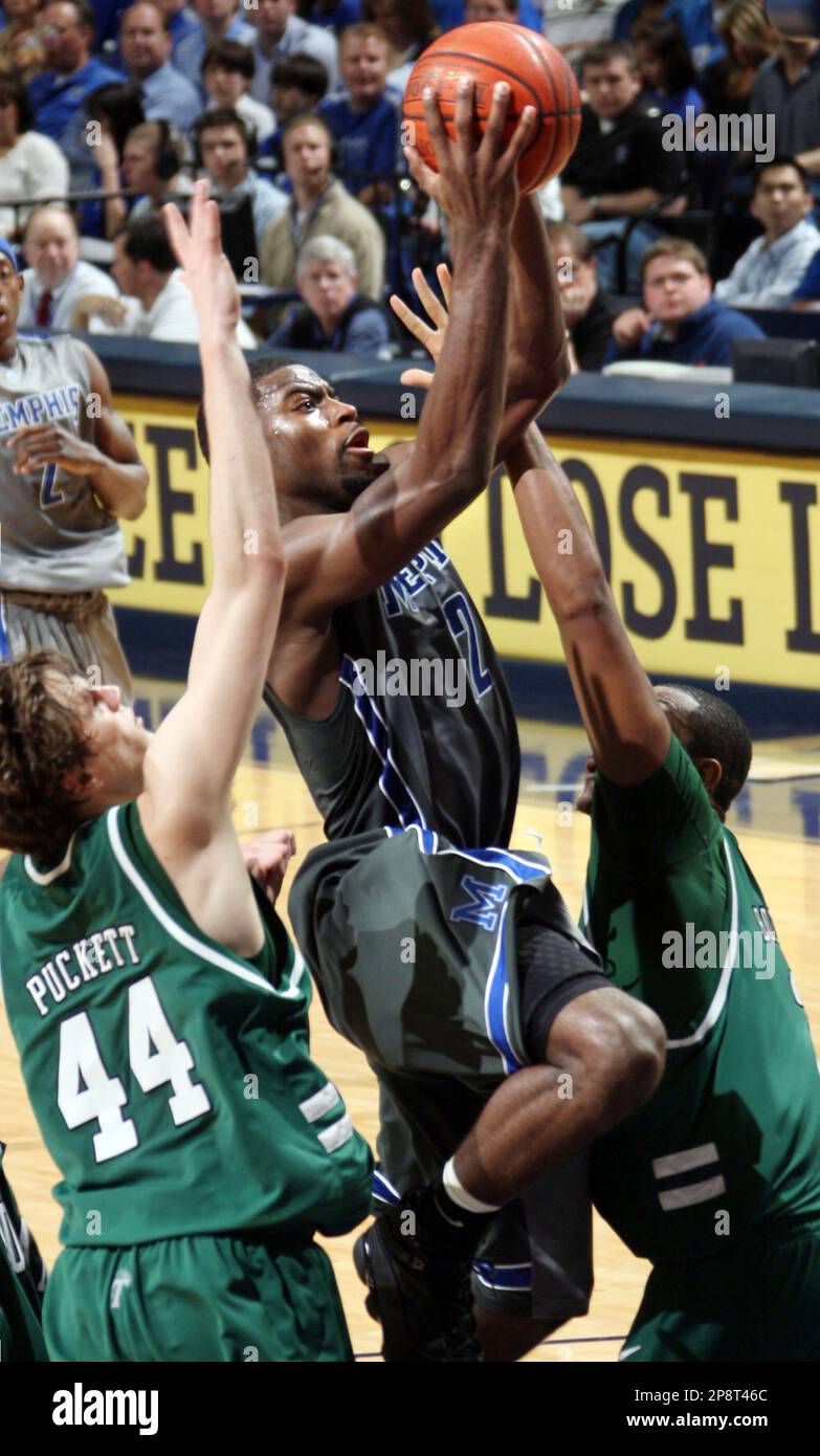 Memphis guard Tyreke Evans, center, shoots as Tulane forward Daniel ...