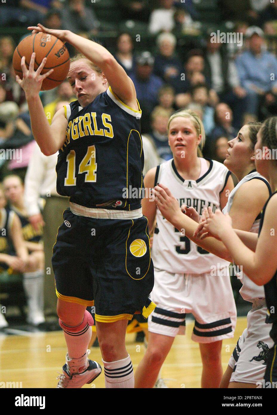 Miles City's Alexia Mader pulls down a rebound during the Montana High ...