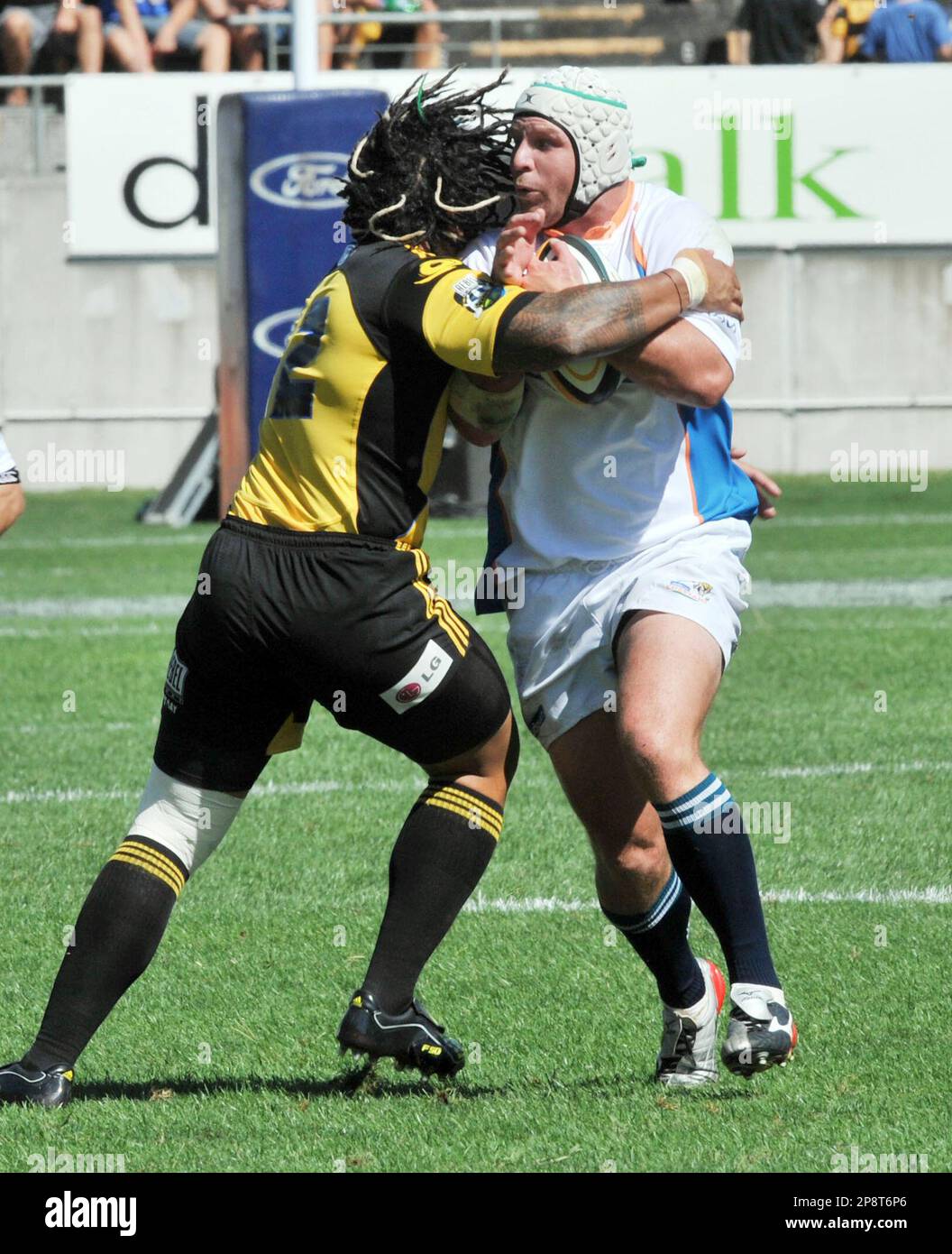South African Cheetahs' Hendro Scholtz, right, runs into New Zealander ...