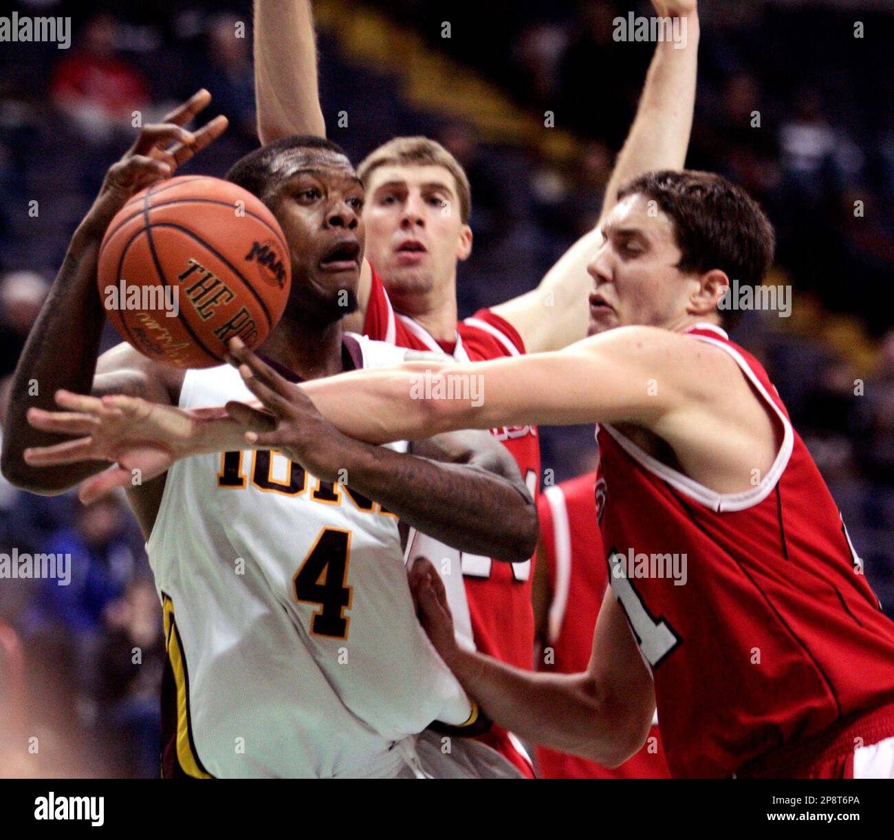 Iona forward Gary Springer (4) grabs a rebound in front of Marist ...