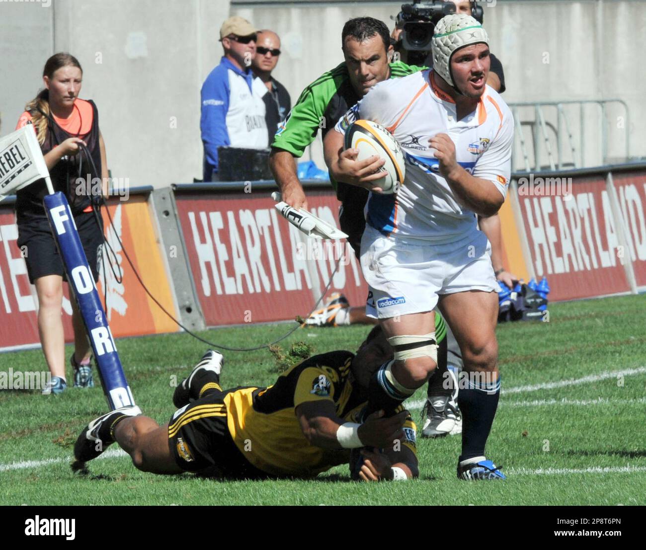 South African Cheetahs' Heinrich Brussow slips a Hurricanes tackle in ...