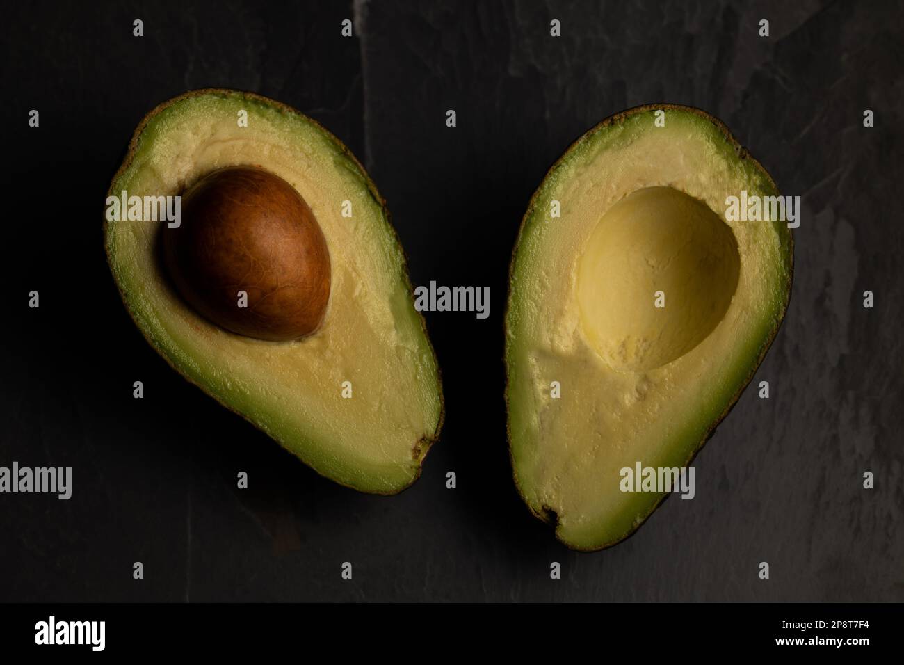 Ripe hass avocado half hi-res stock photography and images - Alamy