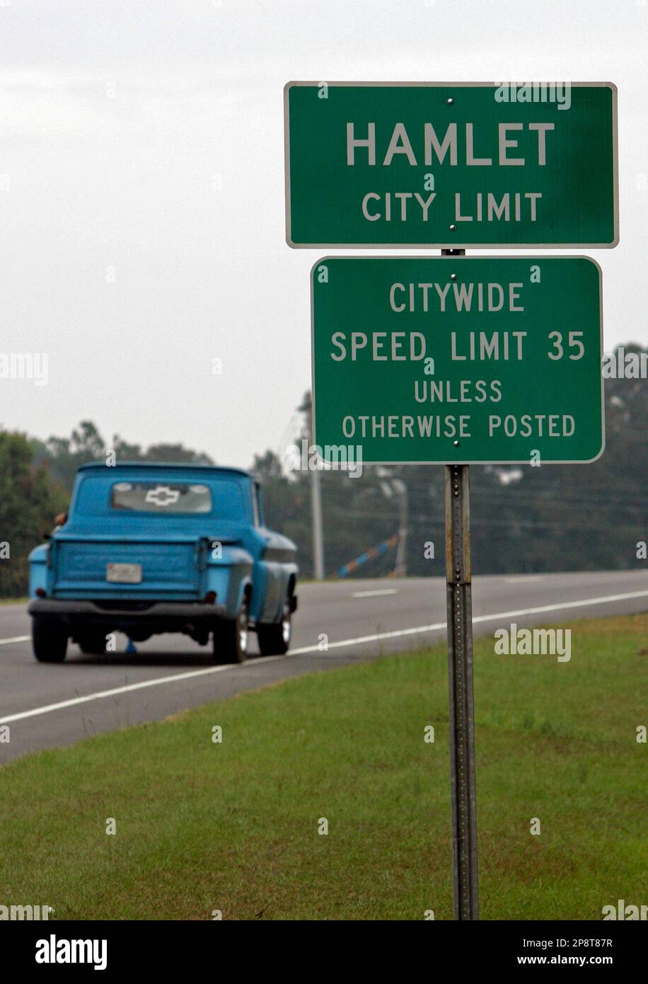 **ADVANCE FOR MONDAY, MARCH 9 AND AFTER** A pickup truck passes a city ...