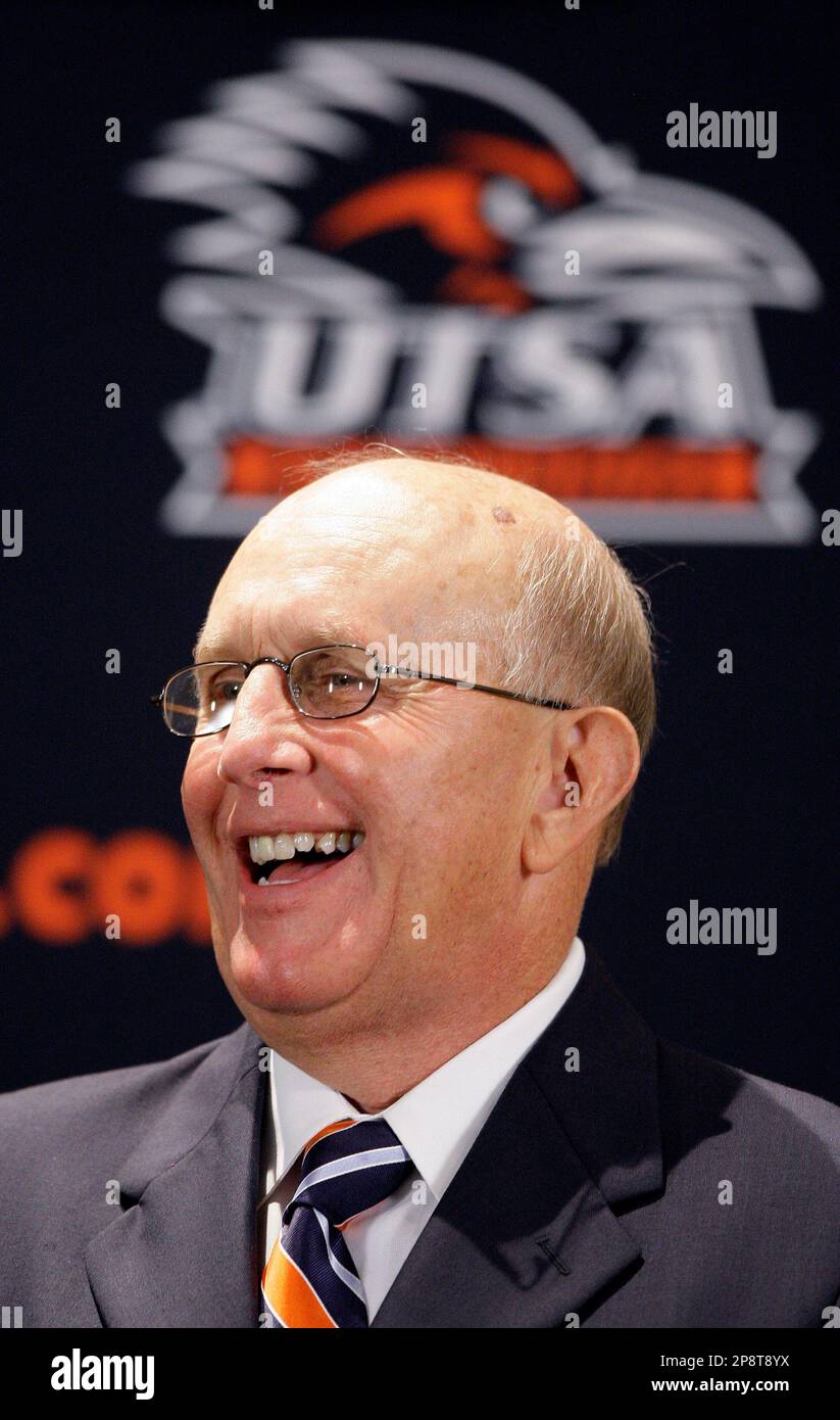 Larry Coker stands under the school logo after he was named the first ...