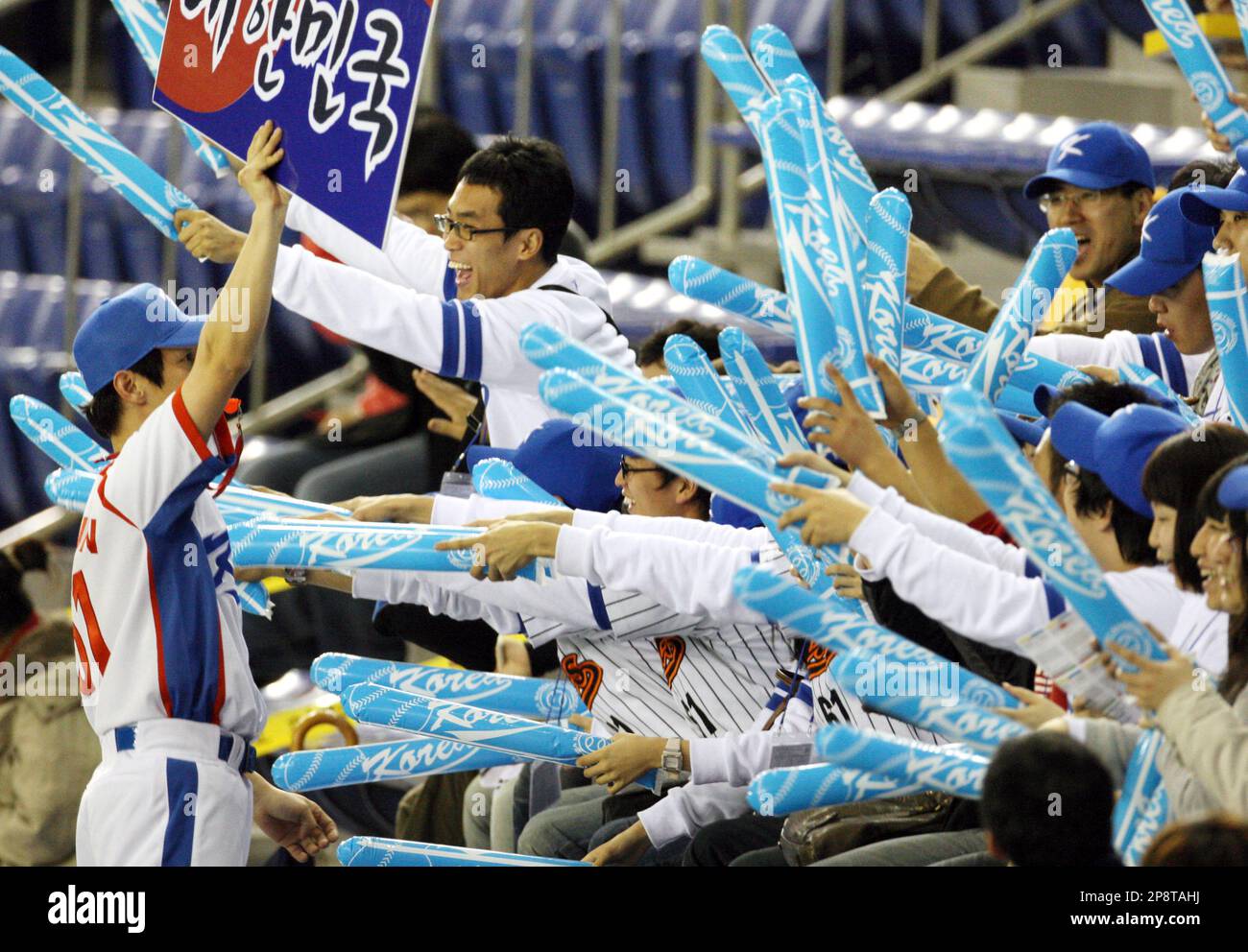 Fans of South Korea cheer at the stand before the World Baseball ...
