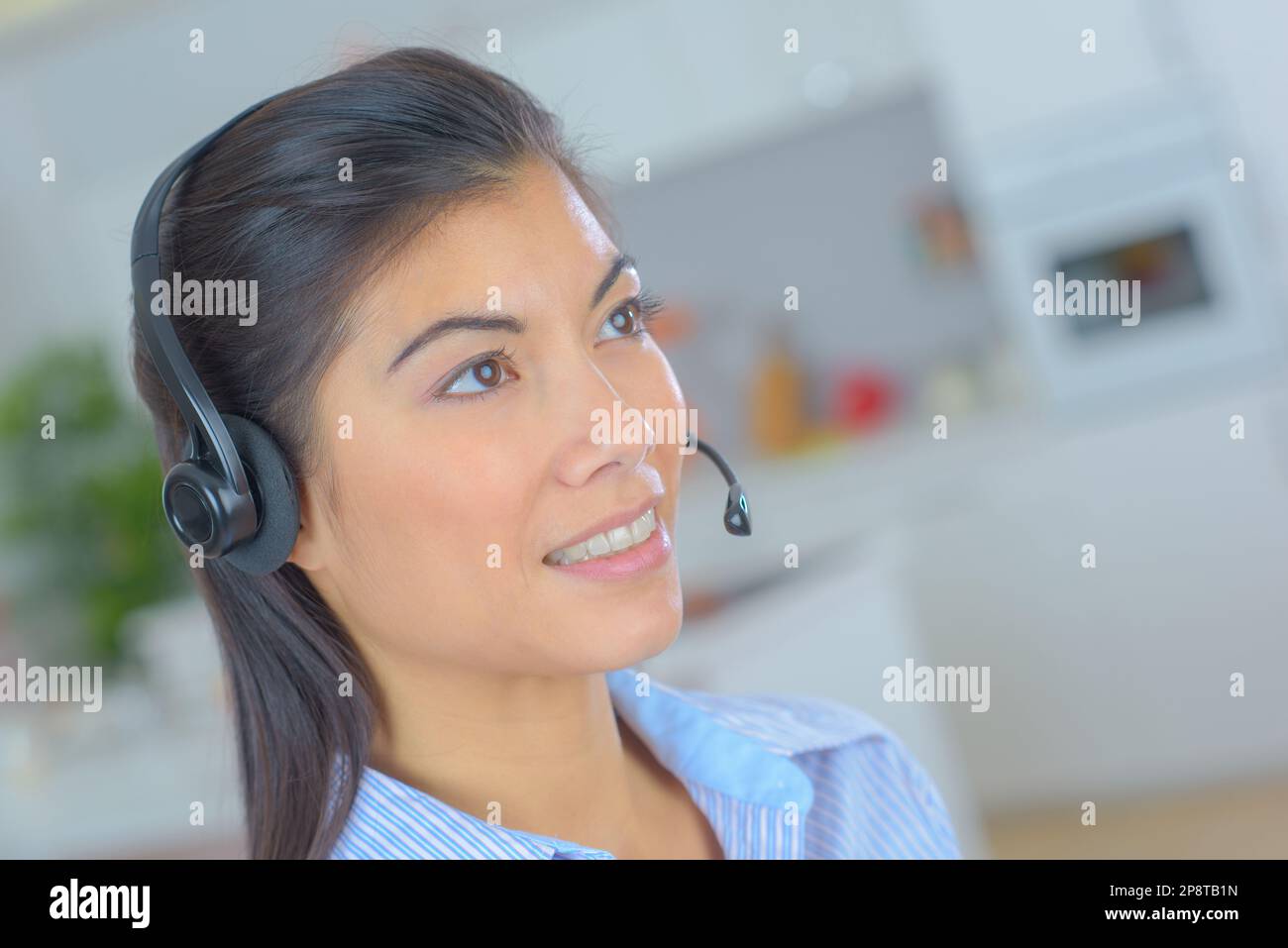 smiling customer service representative talking with client Stock Photo ...