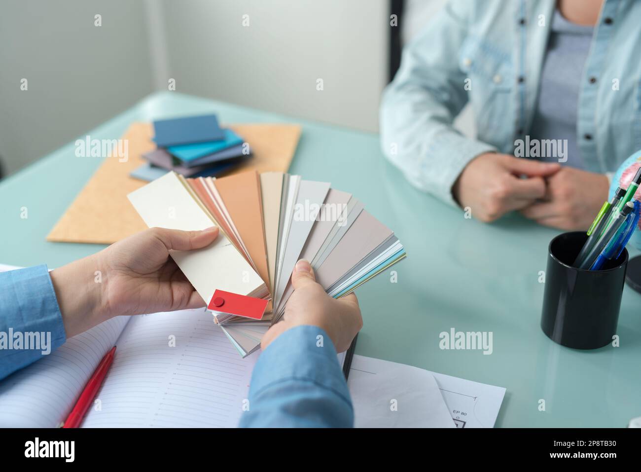 looking at a color swatch and choosing color Stock Photo - Alamy