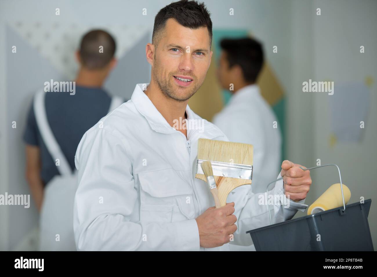 painter standing in front of van Stock Photo - Alamy