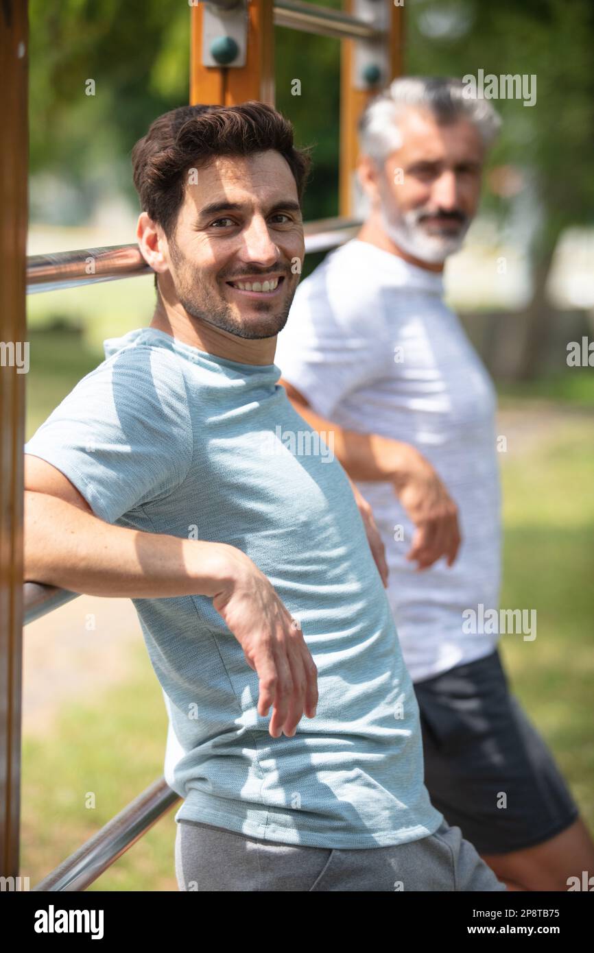 healthy man exercising together at the city on workout bar Stock Photo ...