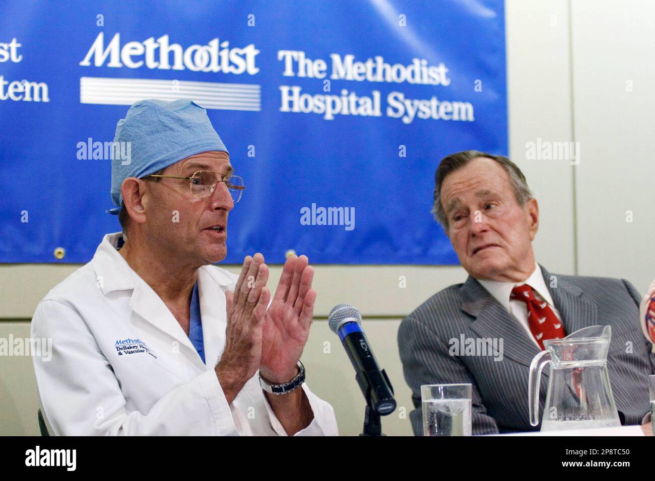 Former President George H.W. Bush listens to heart surgeon Dr. Gerald ...