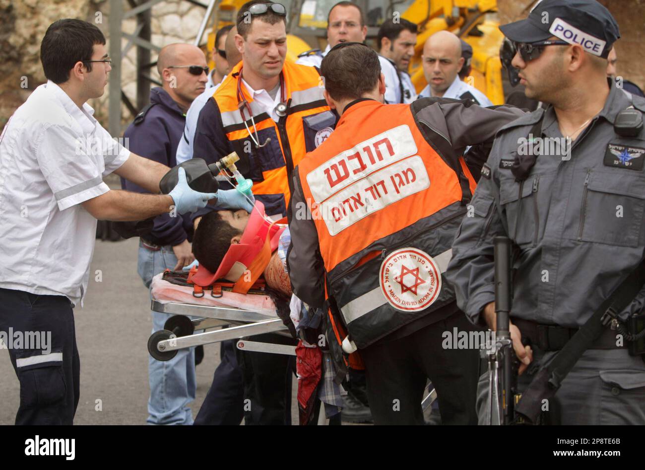Israeli rescue workers evacuate an injured Palestinian man after he ...