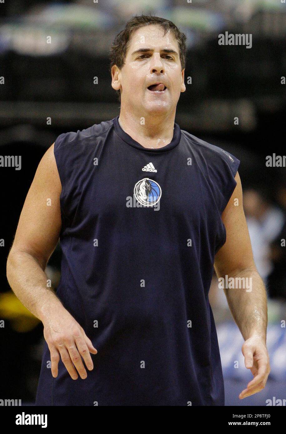 Dallas Mavericks owner Mark Cuban waits for the pass back while shooting hoops before an NBA ...