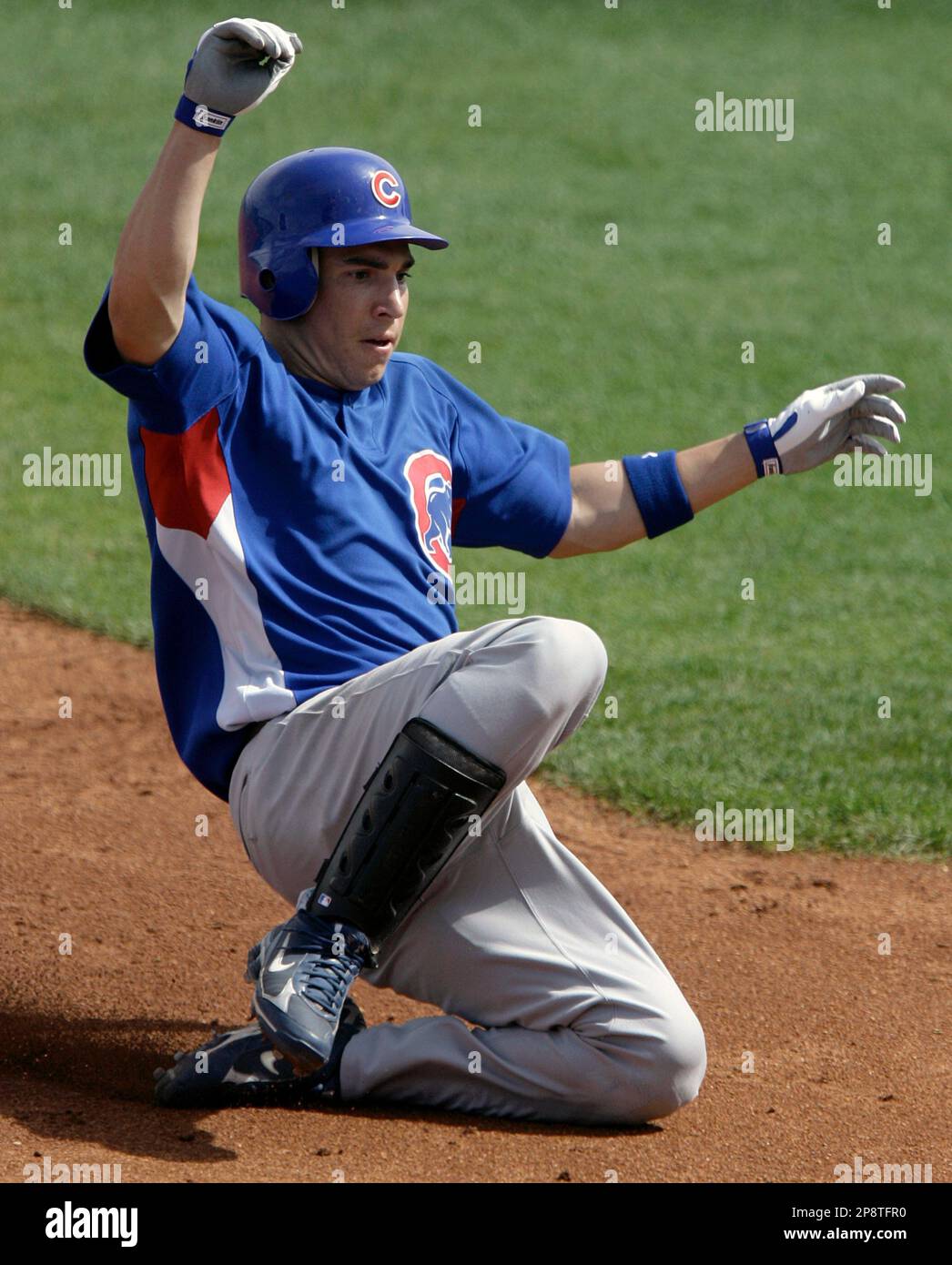 Chicago Cubs' Bobby Scales slides safely into third after hitting a ...