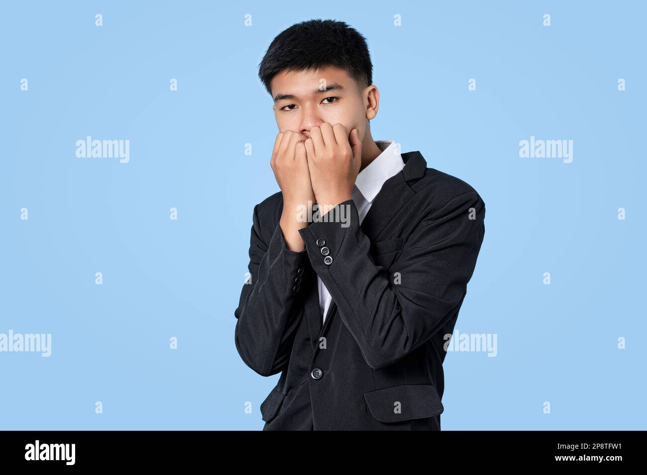 Worried businessman on blue background hi-res stock photography and ...