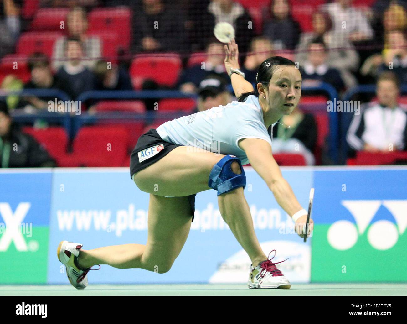 France's Pi Hongyan hits a shot during her women's singles first-round ...