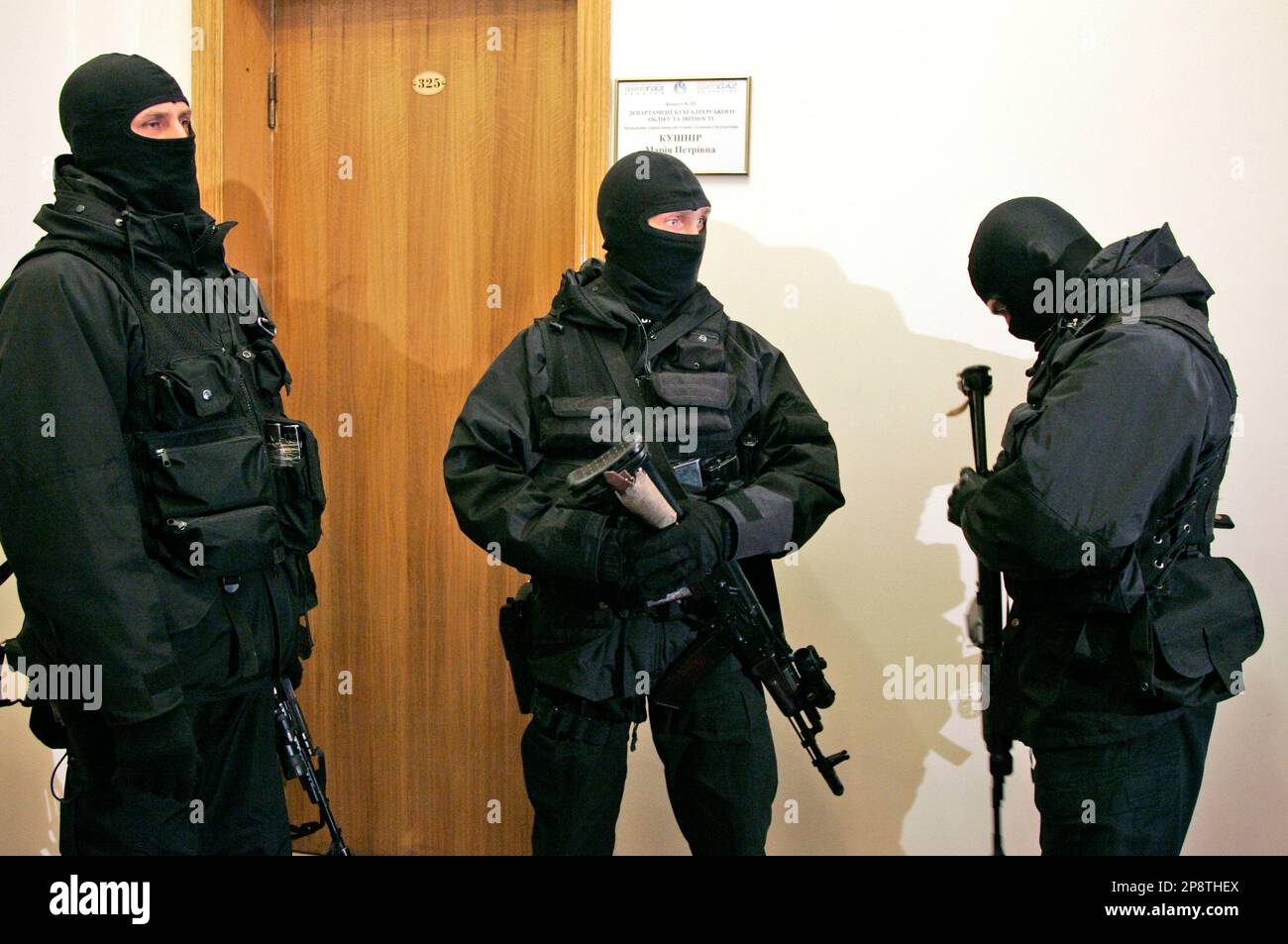 Ukrainian national security service armed agents wearing masks raid the ...